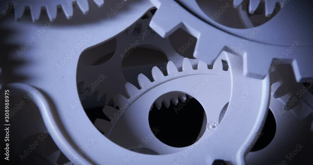 Close-up rotation of the plastic gears inside a clock mechanism Stock ...