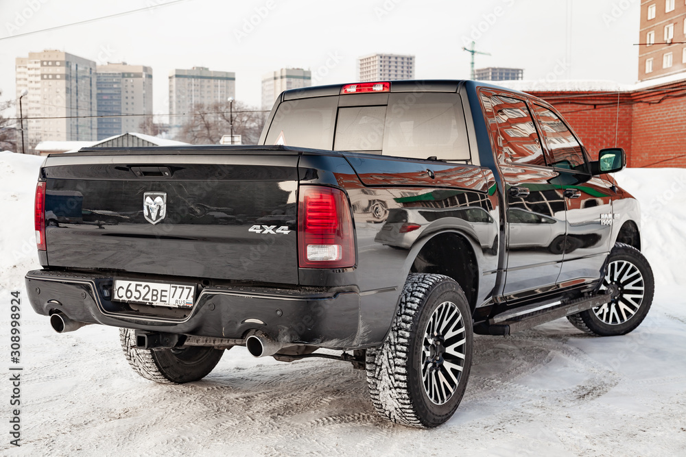 Black Dodge Ram with an engine of 5.7 liters rear view on the car ...