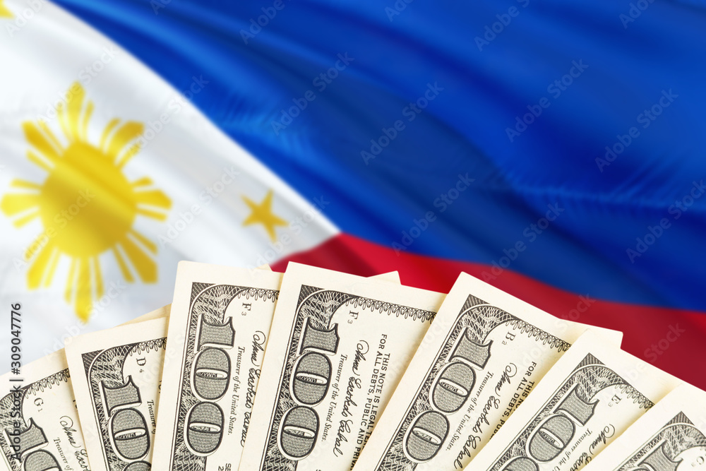 Philippines economy concept. Dollar banknotes on the side of national ...
