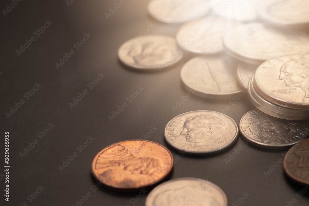 Money, US Dollars bank notes, penny, nickel, dime, quarter on black ...