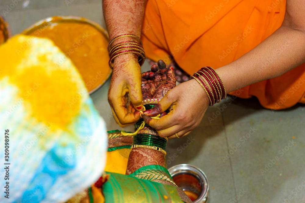 Indian Traditional Wedding: women hand in haldi ceremony Stock Photo ...