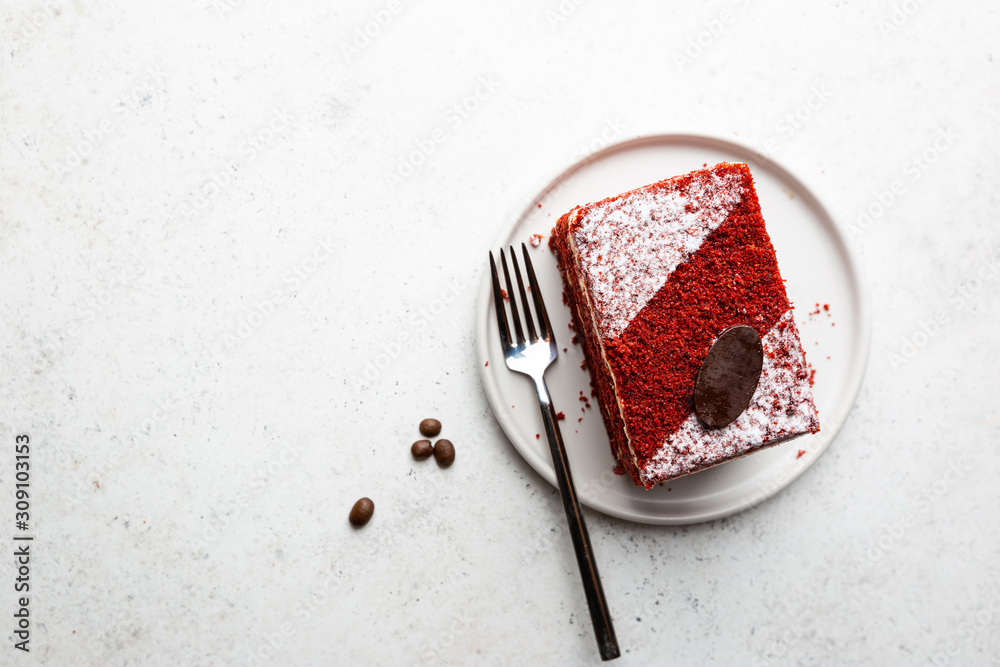 Top view of slice of red velvet cake with copy space on white ...