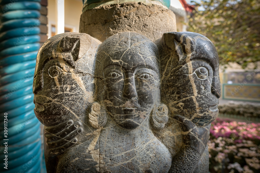 Sculpted stone pillar base in the garden of Moghadam historic house ...