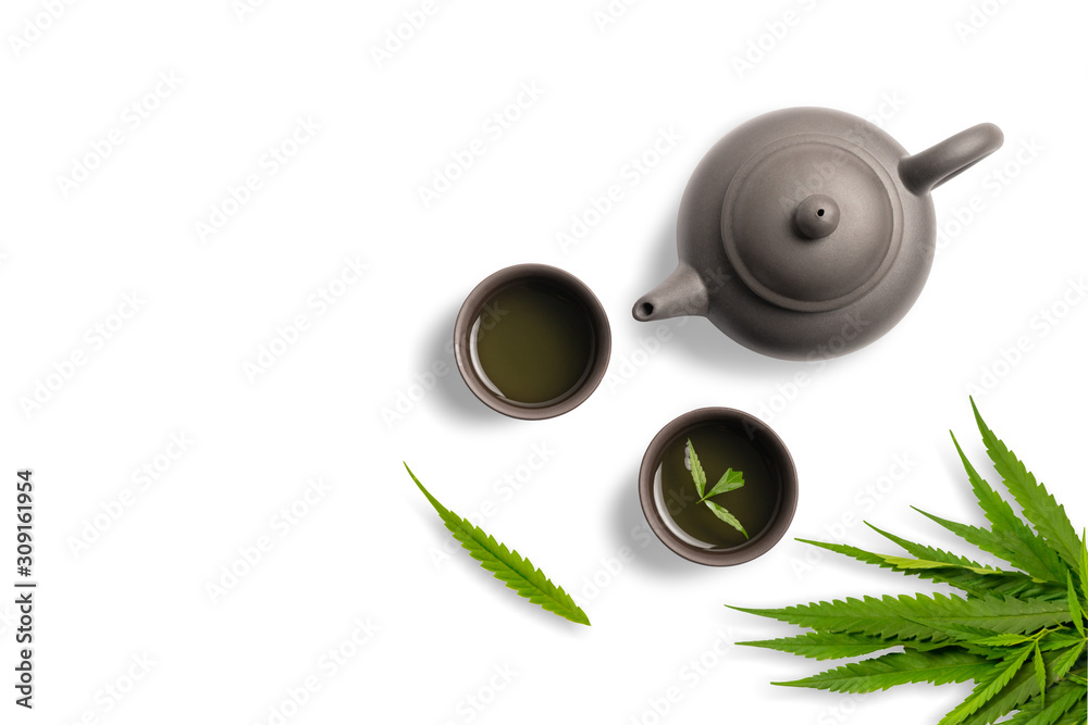 Tea made from cannabis leaves ,A glass of hot marijuana tea on white ...