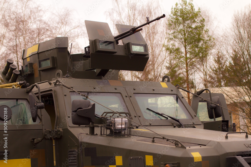 Armored military transportation truck. War patrol vehicle with a ...