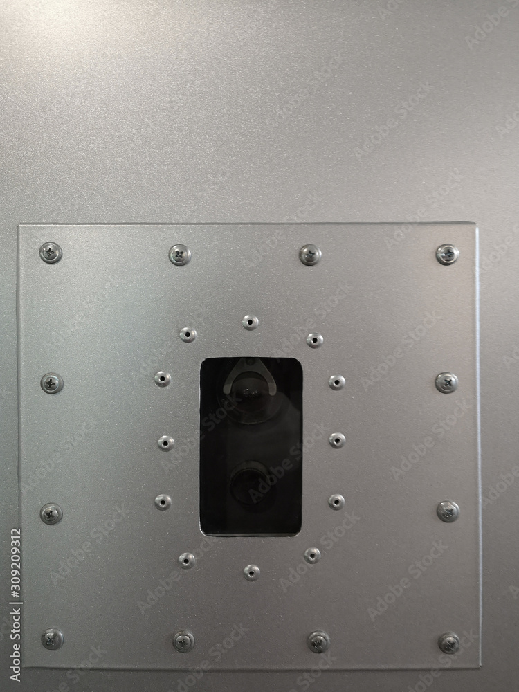 Vintage video camera hidden behind steel panels. Mecanical engineering ...