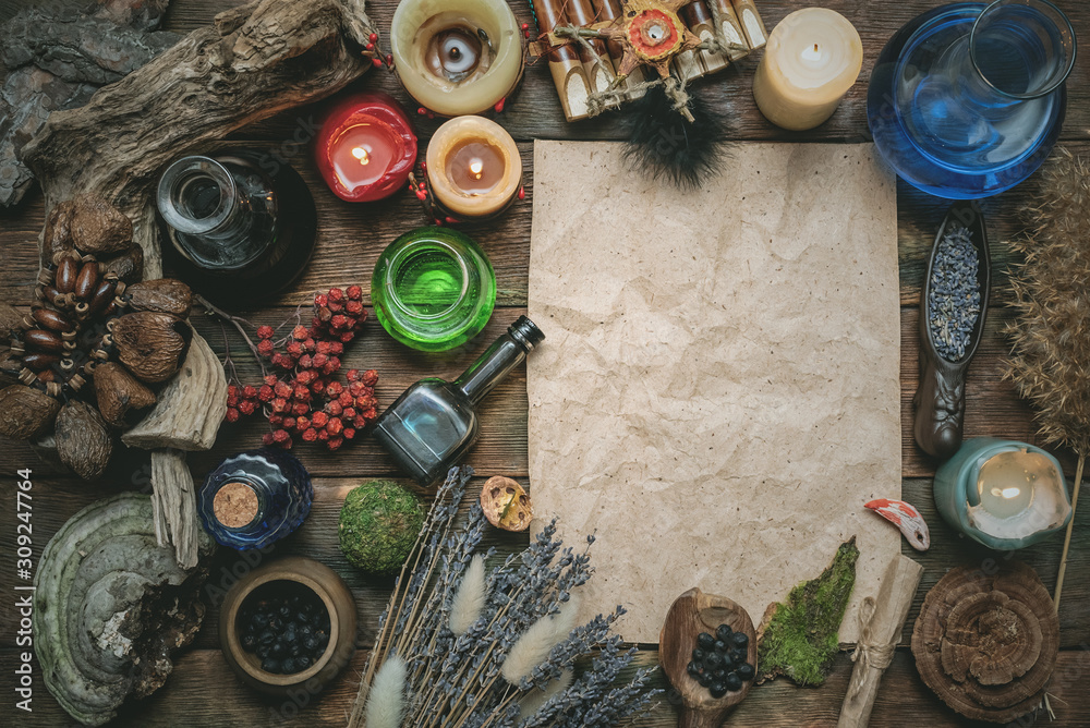 Ancient blank magic scroll with copy space on wizard table background ...