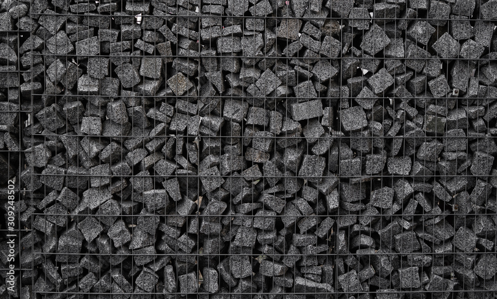 A stone wall that uses metal and stone in harmony. Ecology friendly ...