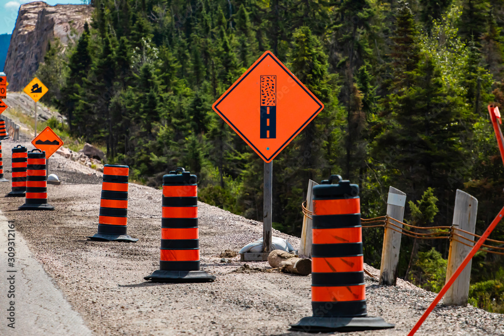 Paved surface ends ahead orange sign, Temporary condition road signs ...