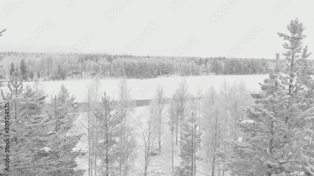 Drone footage from the Finnish Lapland in the winter, flying over the ...