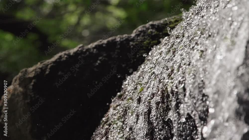 waterfall texture pouring water in green park at summer closeup. Small ...