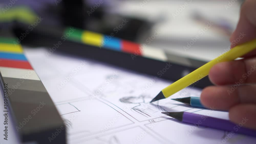 Designer creative drawing in storyboard for film movie, Video Pre ...