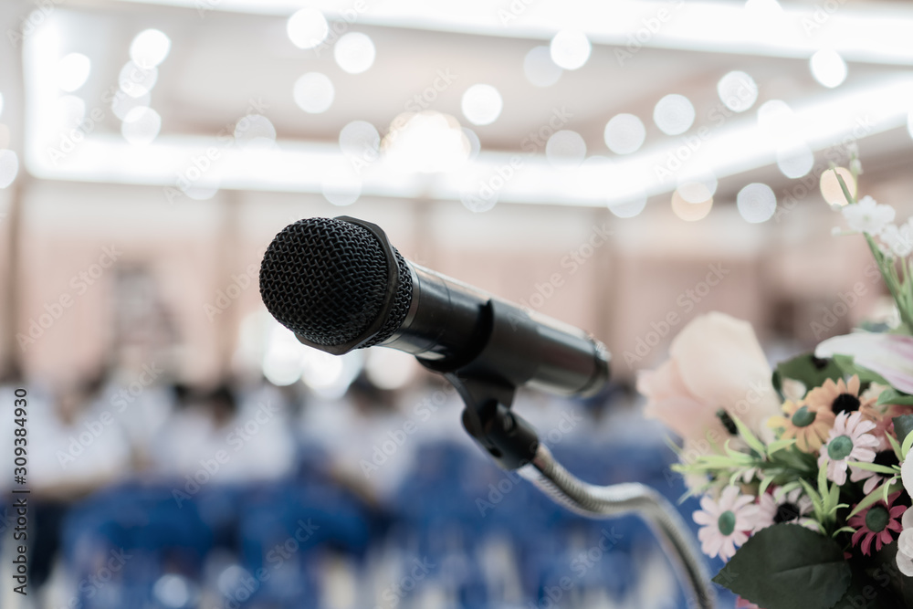 Microphone on abstract blurred of speech in seminar room or speaking ...