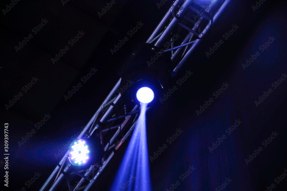 blue color wide lens projector with light beam at night . abstract ...