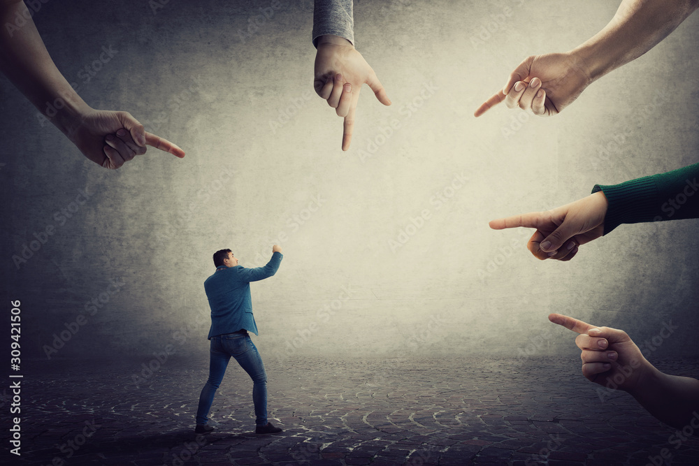 Frustrated businessman starts fighting against people blaming him. Self ...