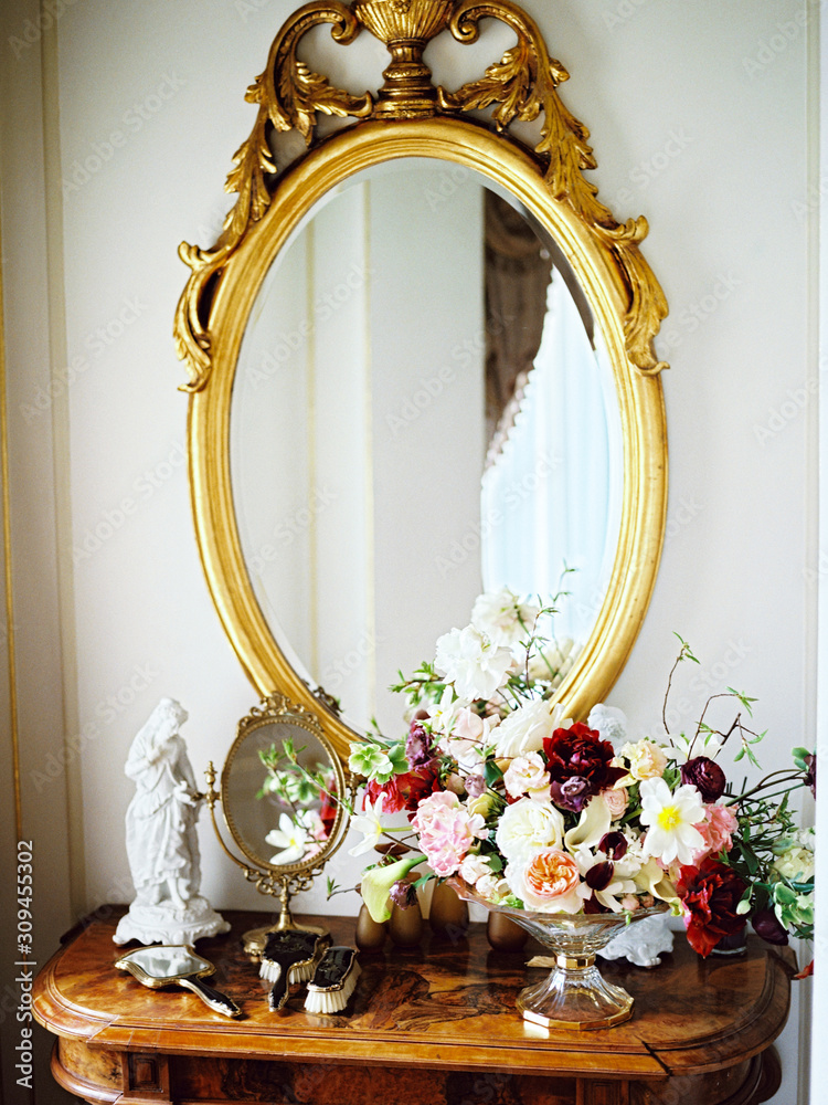 Dressing table with flower composition in classic interior Stock Photo ...