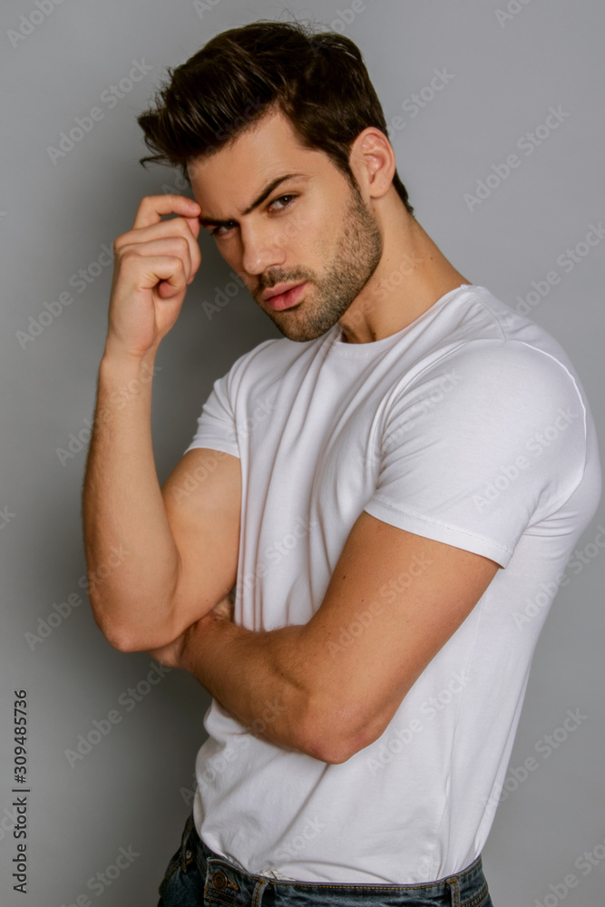 Muscle strong face beautiful stripped male model portrait in denim blue ...