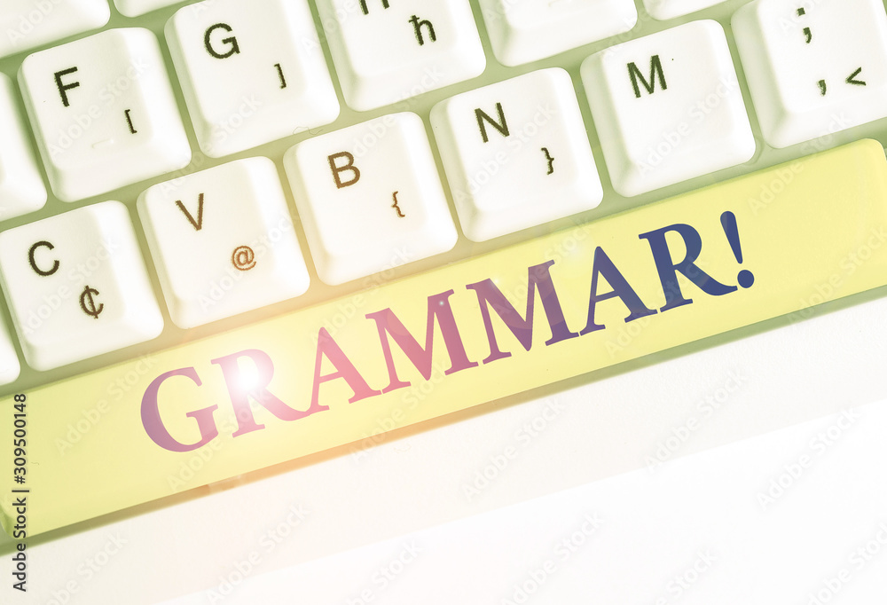 Writing note showing Grammar. Business concept for whole system ...