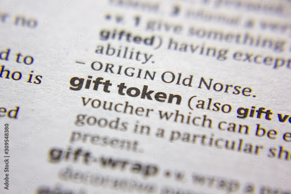 Word or phrase Gift token in a dictionary. Stock Photo | Adobe Stock