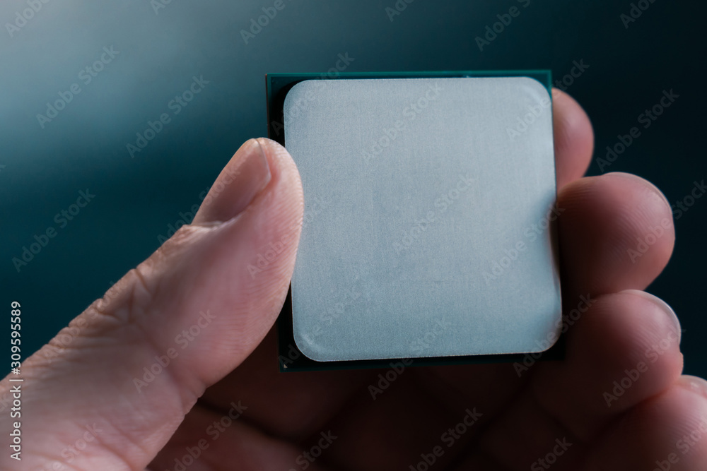 Hand holding CPU. Coonsumer 7 nanometer desktop CPU, processoor ...