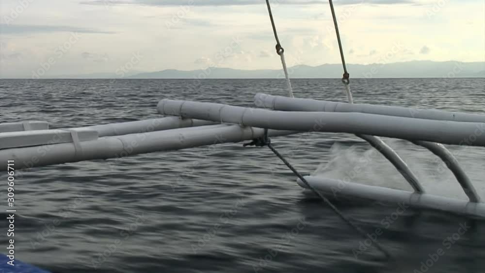 Bamboo wings of philippine boat on background of sea on islands of ...