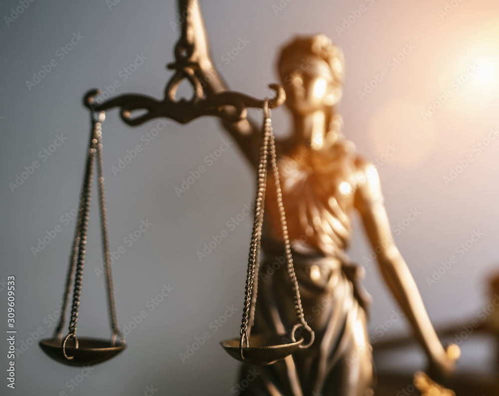 Statue of lady justice on bright background - Side view with copy space ...