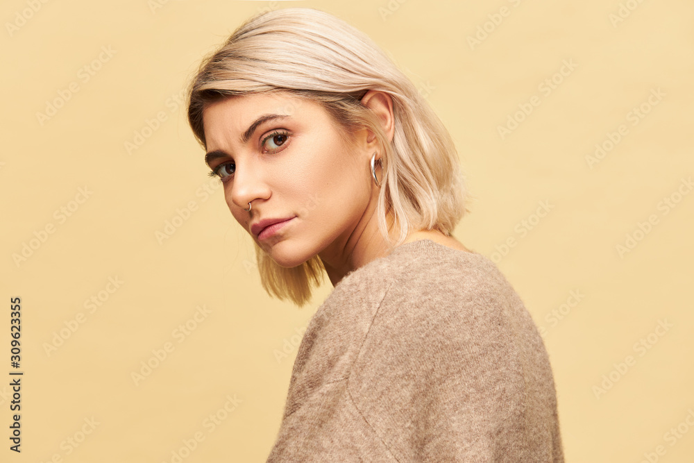Half profile image of beautiful young woman with bob hairdo posing in ...