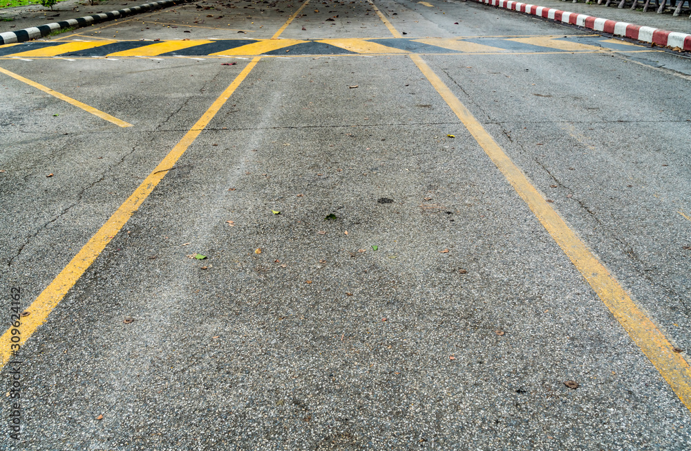 Big speed bump on asphalt road Stock Photo | Adobe Stock