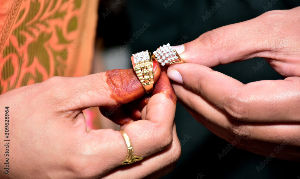 An Indian bride and groom their Shows Engagement Rings during a Hindu ...