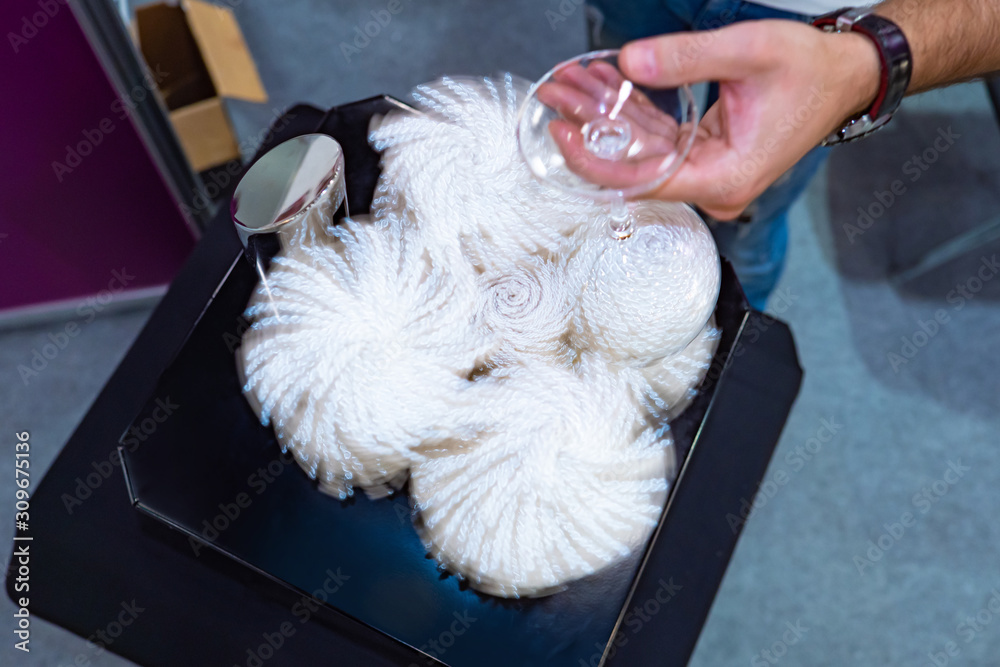 Man is polishing a wine glass. Polishing glassware using technique ...