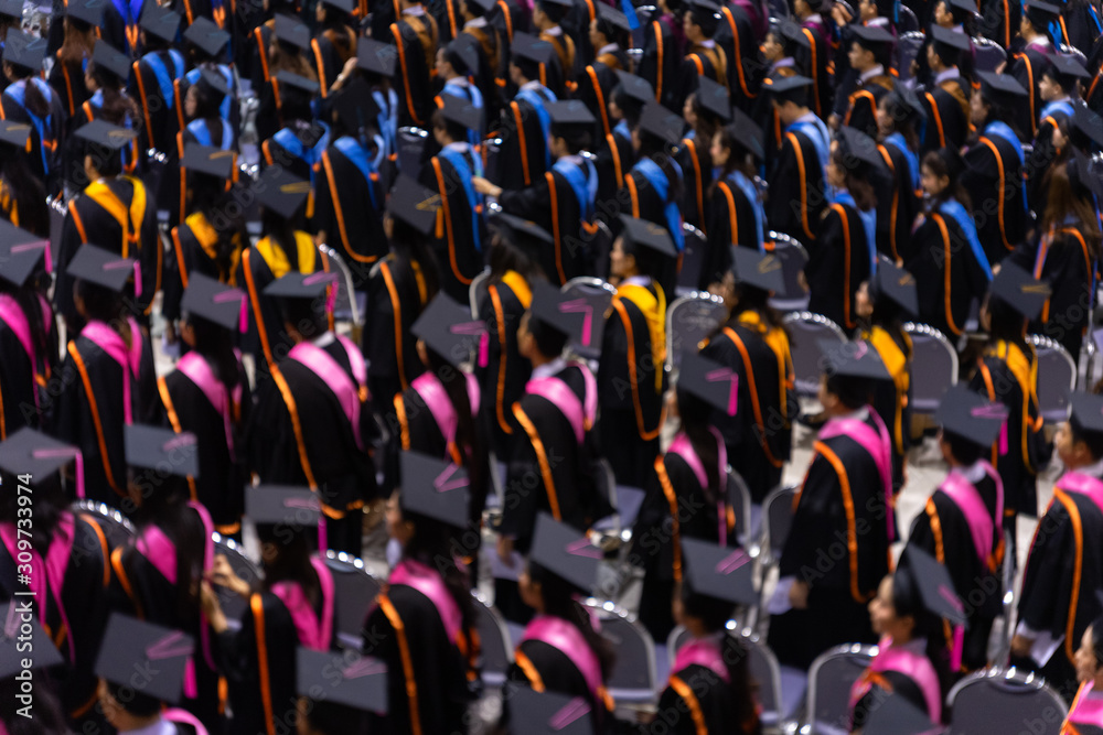 Rear view and soft selective focus of the graduates in the graduation ...
