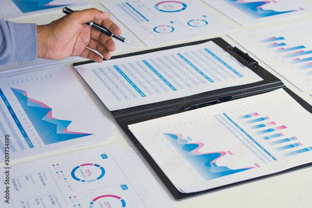 businessman working calculate data document graph chart report ...