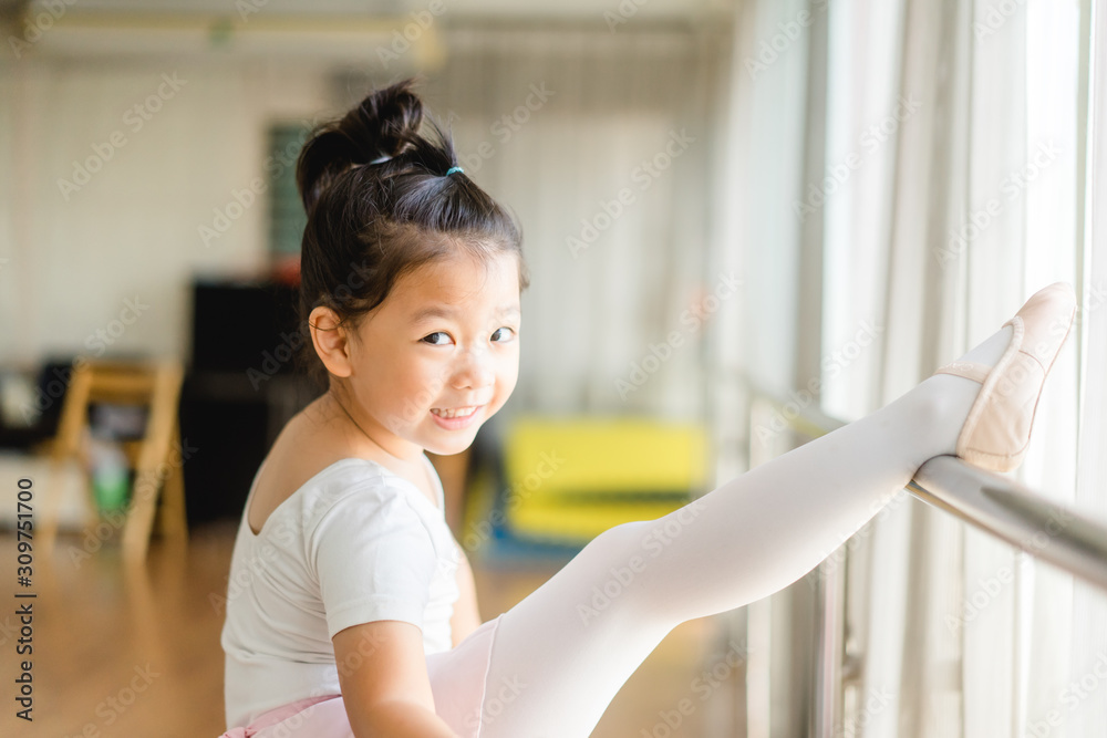 Little ballerinas in ballet studio.Cute little asian girl in a leotard ...
