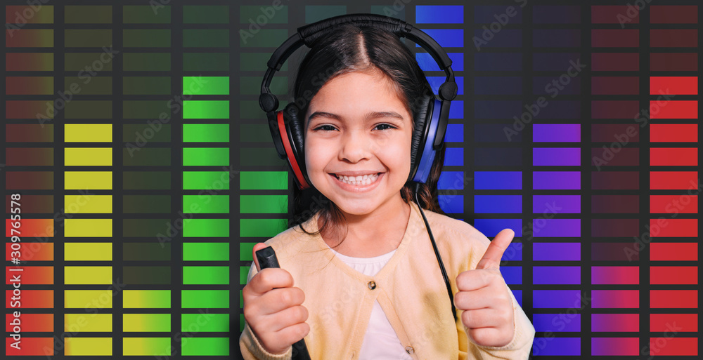 Positive mixed race girl wearing headphones getting hearing test ...