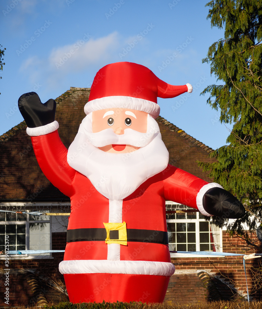 Santa Claus Inflatable Along roadside waving Father Christmas Stock ...