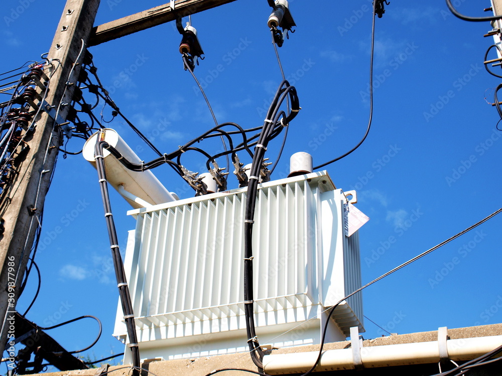 Closeup - White Transformer on the pole Three-phase transformer for ...