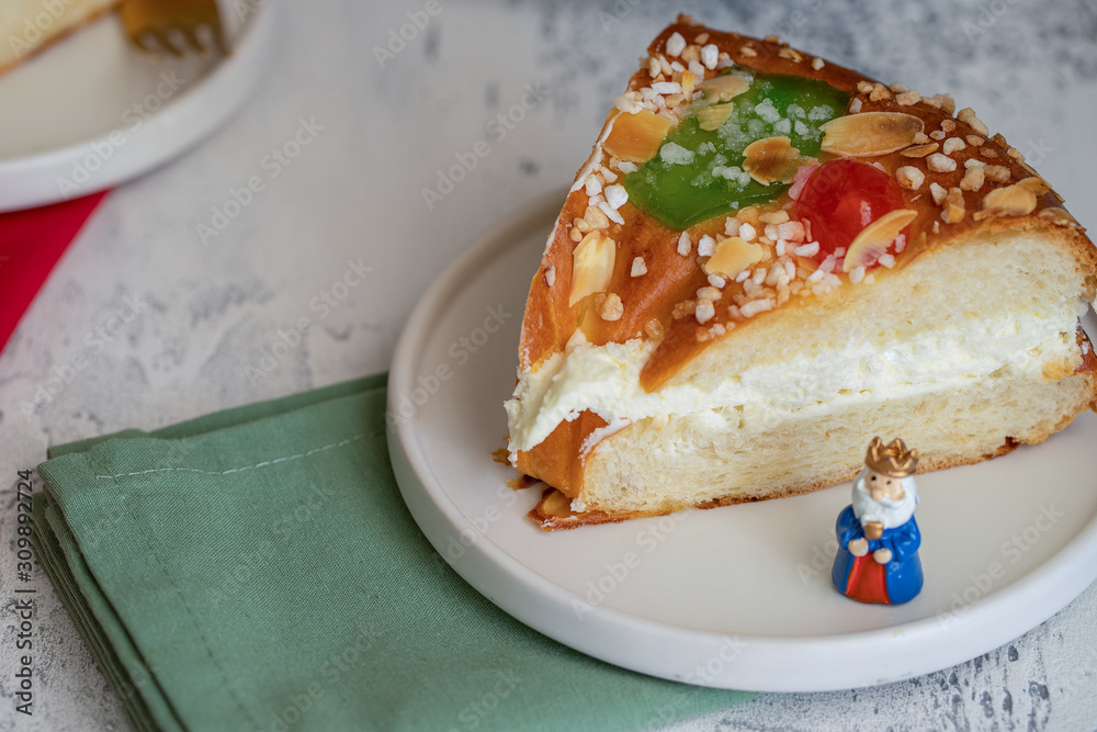 Piece of Roscon de reyes, spanish Christmas cake to celebrate Epiphany ...