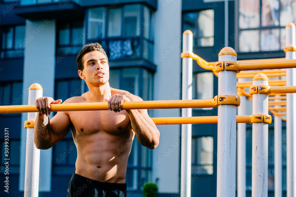 Portrait of athlete young mixed race man resting after exercises on ...