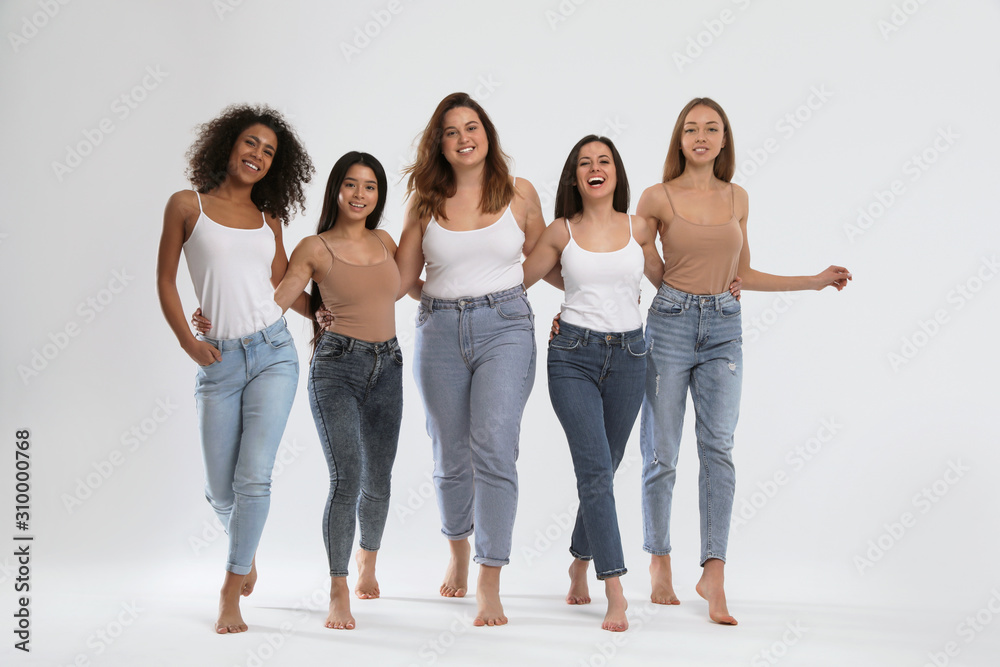 Group of women with different body types on light background Stock ...