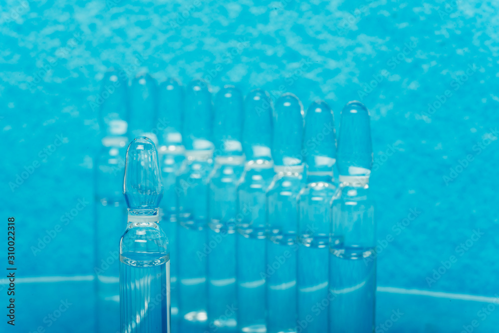 Glass medical ampoule vial for injection. Medicine is liquid sodium ...