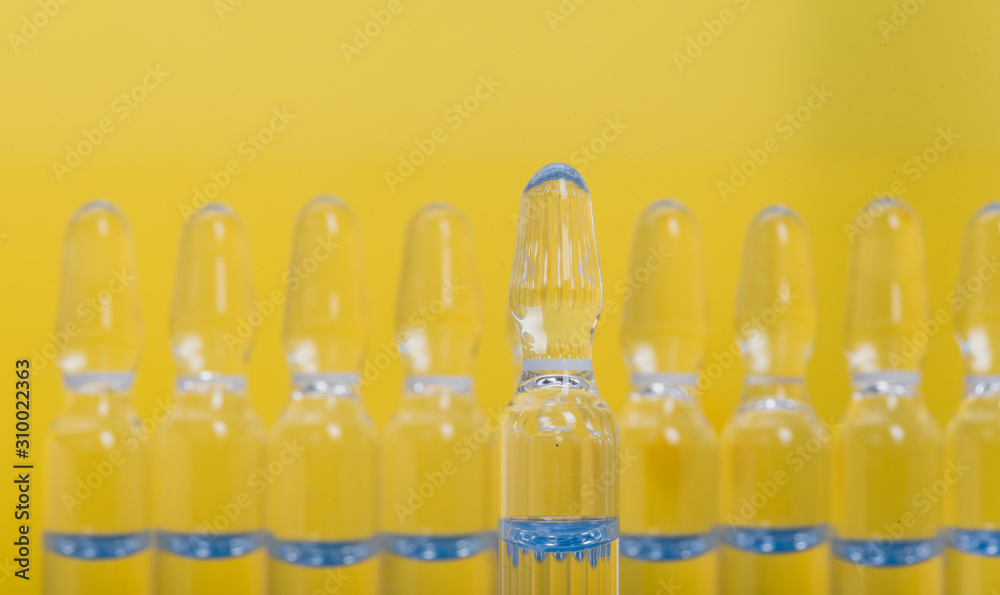 Glass medical ampoule vial for injection. Medicine is liquid sodium ...