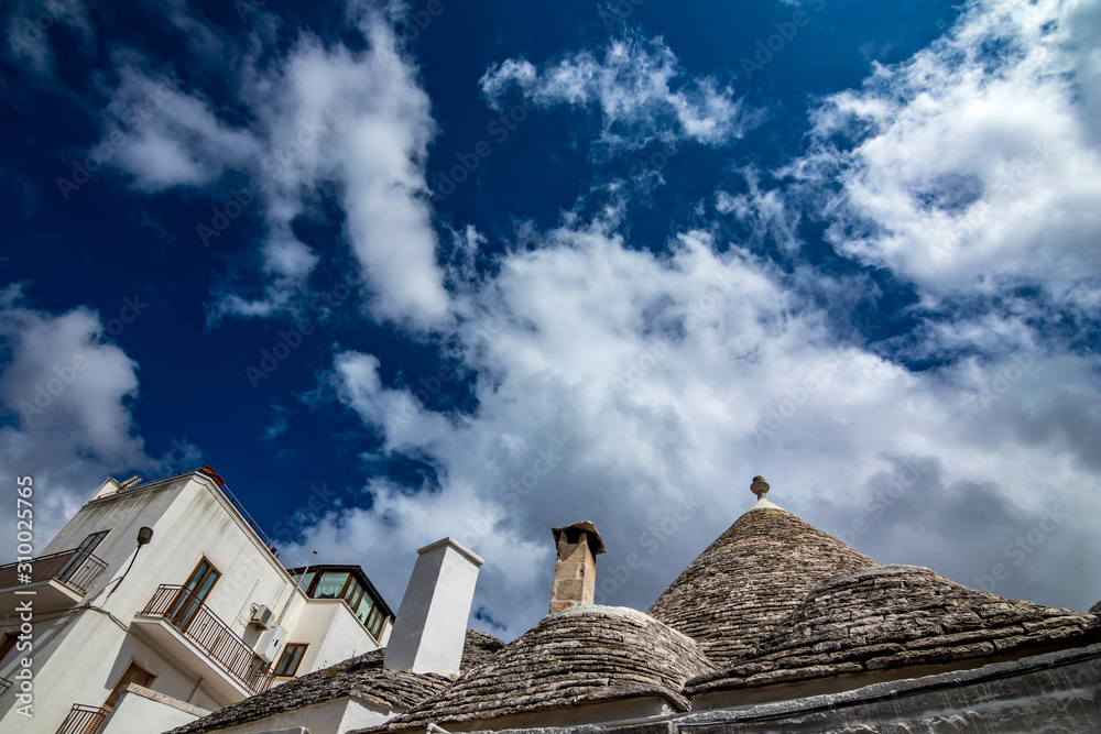 Roofs of truli, typical whitewashed cylindrical houses in Alberobello ...