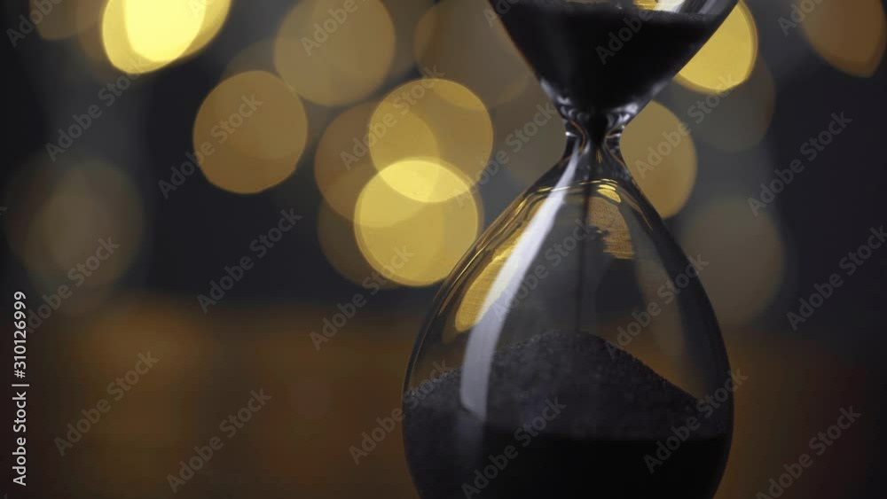 Close up of an hourglass. Time concept Stock Video | Adobe Stock