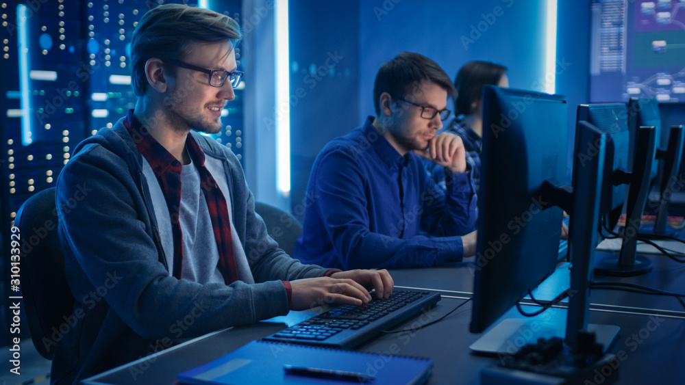 Team of Young IT Programers Working on Desktop Computers in Data Center ...