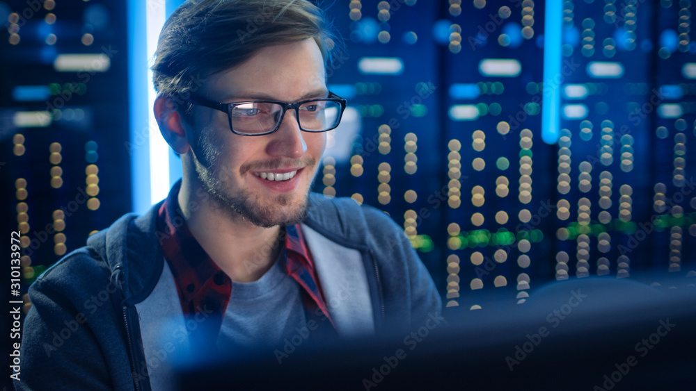 Portrait of Smart SmilingFocused Young Man Wearing Glasses Working on ...