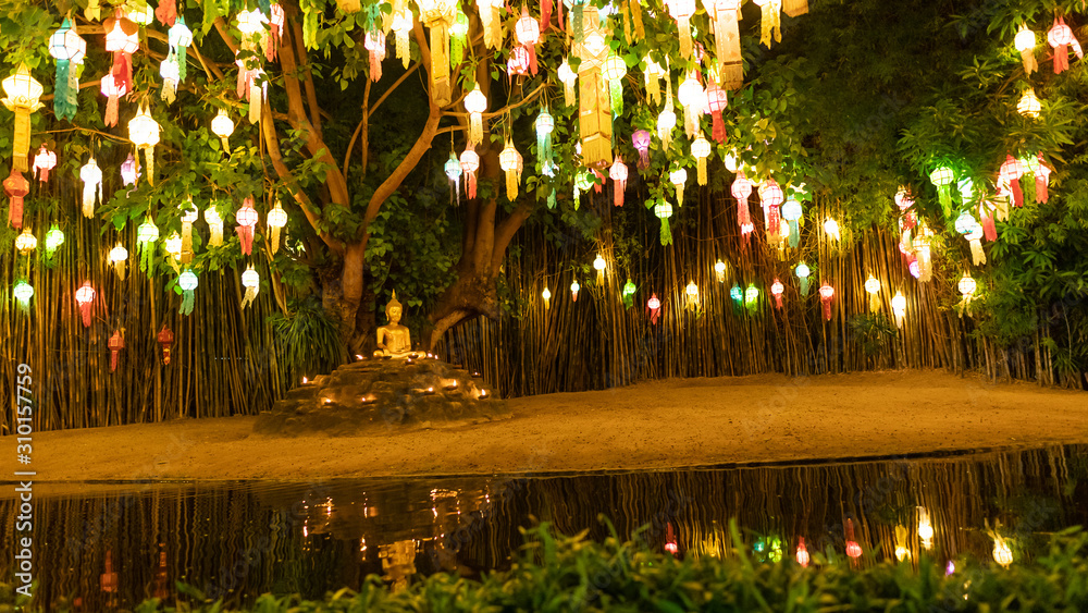 Bodhi tree with Buddha images and surrounding rivers and many hanging ...