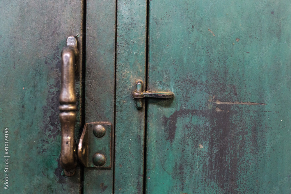 Vintage handle on a well worn metal locker with paint scratches Stock ...