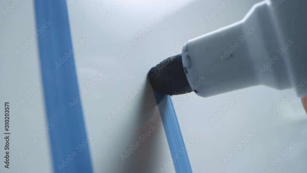 Video „Macro Follow Shot of a Blue Marker Pen Being Held with a Hand ...