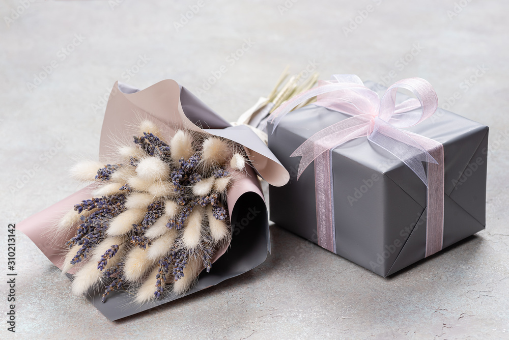 Bouquet of lavender and lagurus with gray-purple packaging with a gift ...