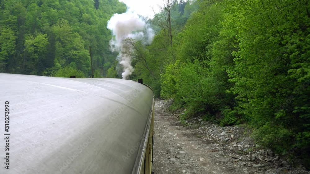 view from the roof of a retro train wagon, Old steam locomotive in ...